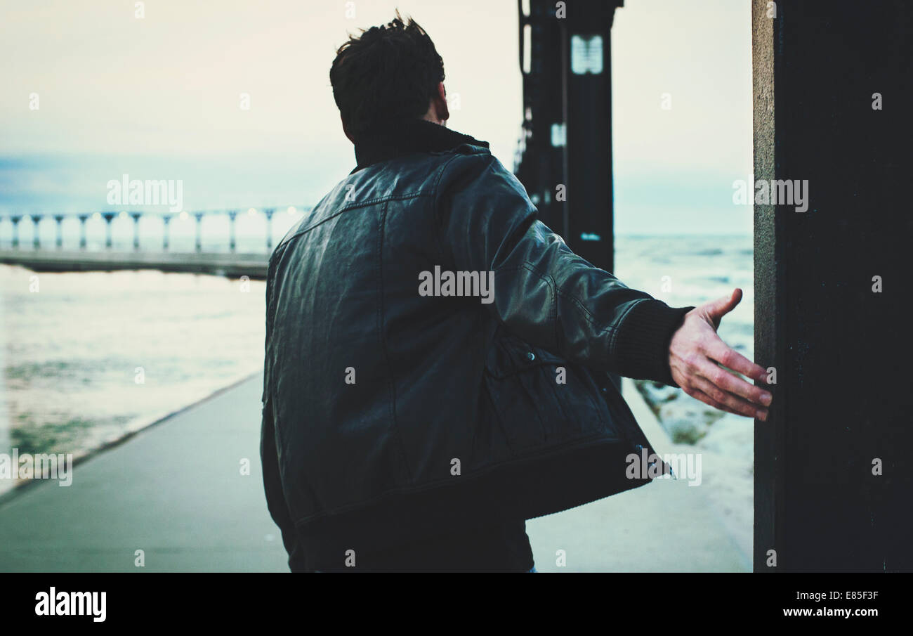 Man Walking Away Looking Back