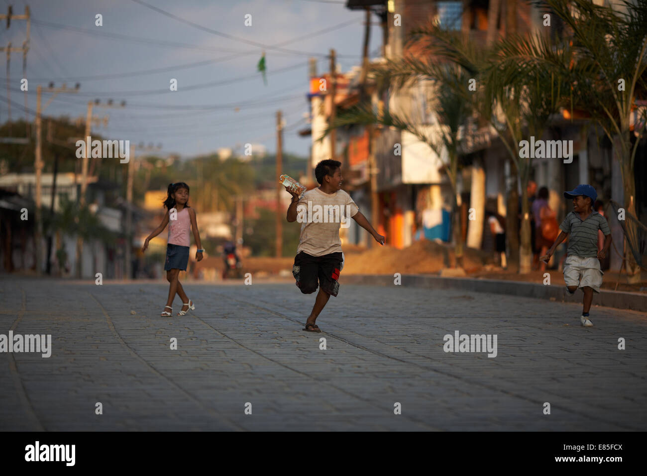 Running Children in Puerto Escondido main street (Mexico Stock Photo ...