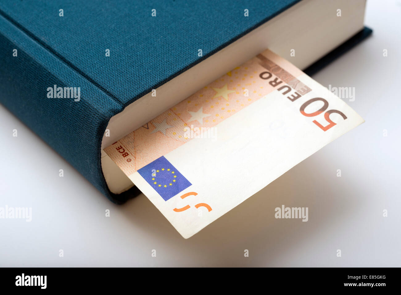 euro bill in a blue book Stock Photo - Alamy