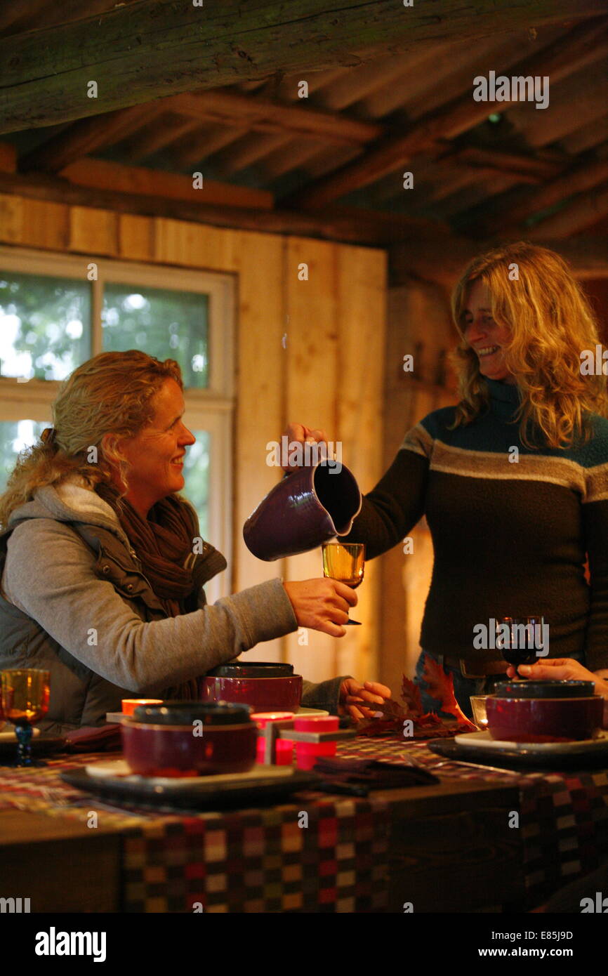 Two women in a converted barn Stock Photo - Alamy