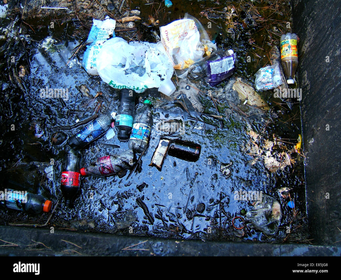 Trash in a pit Stock Photo - Alamy