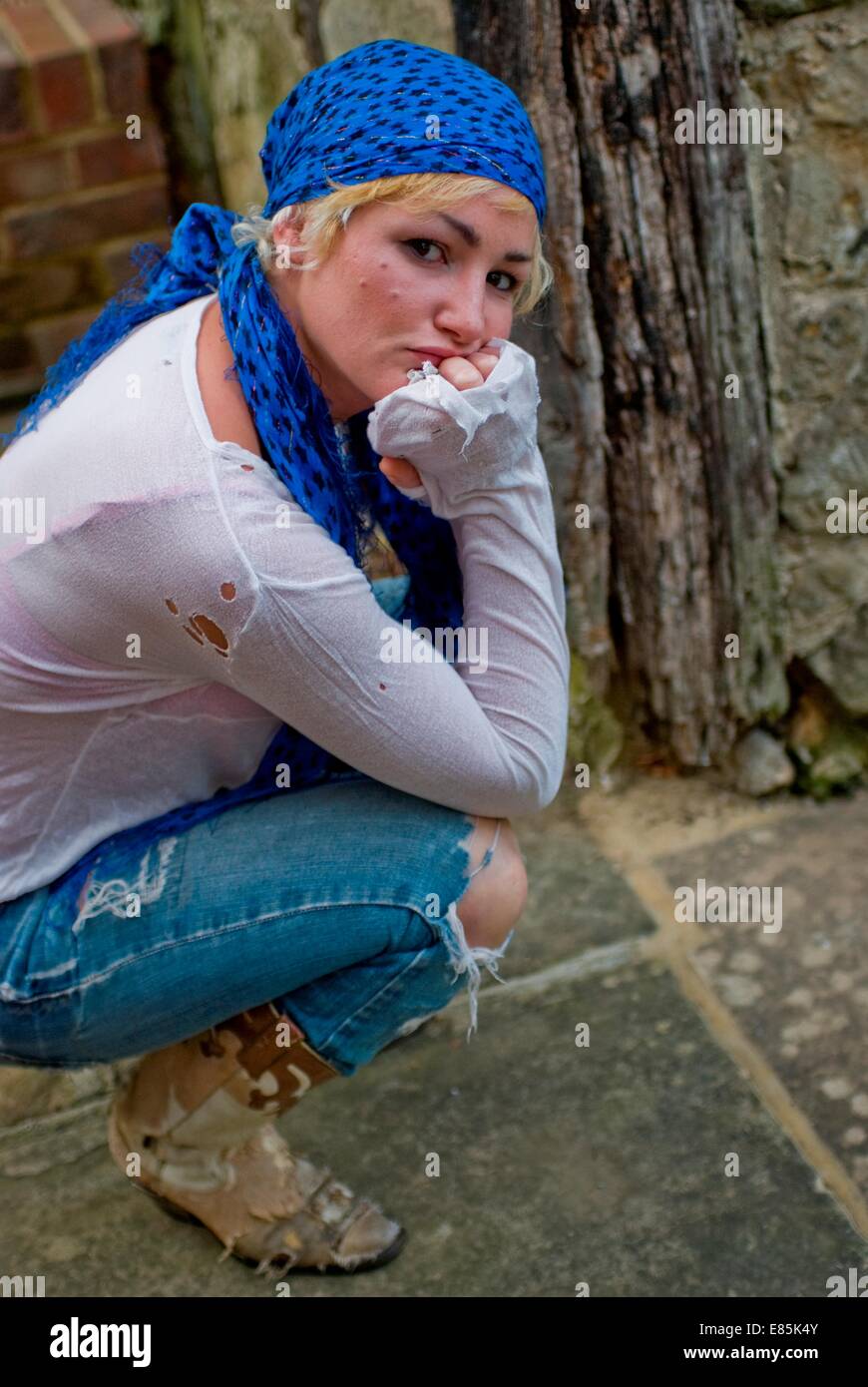 Woman in ripped clothing blue hi-res stock photography and images - Alamy