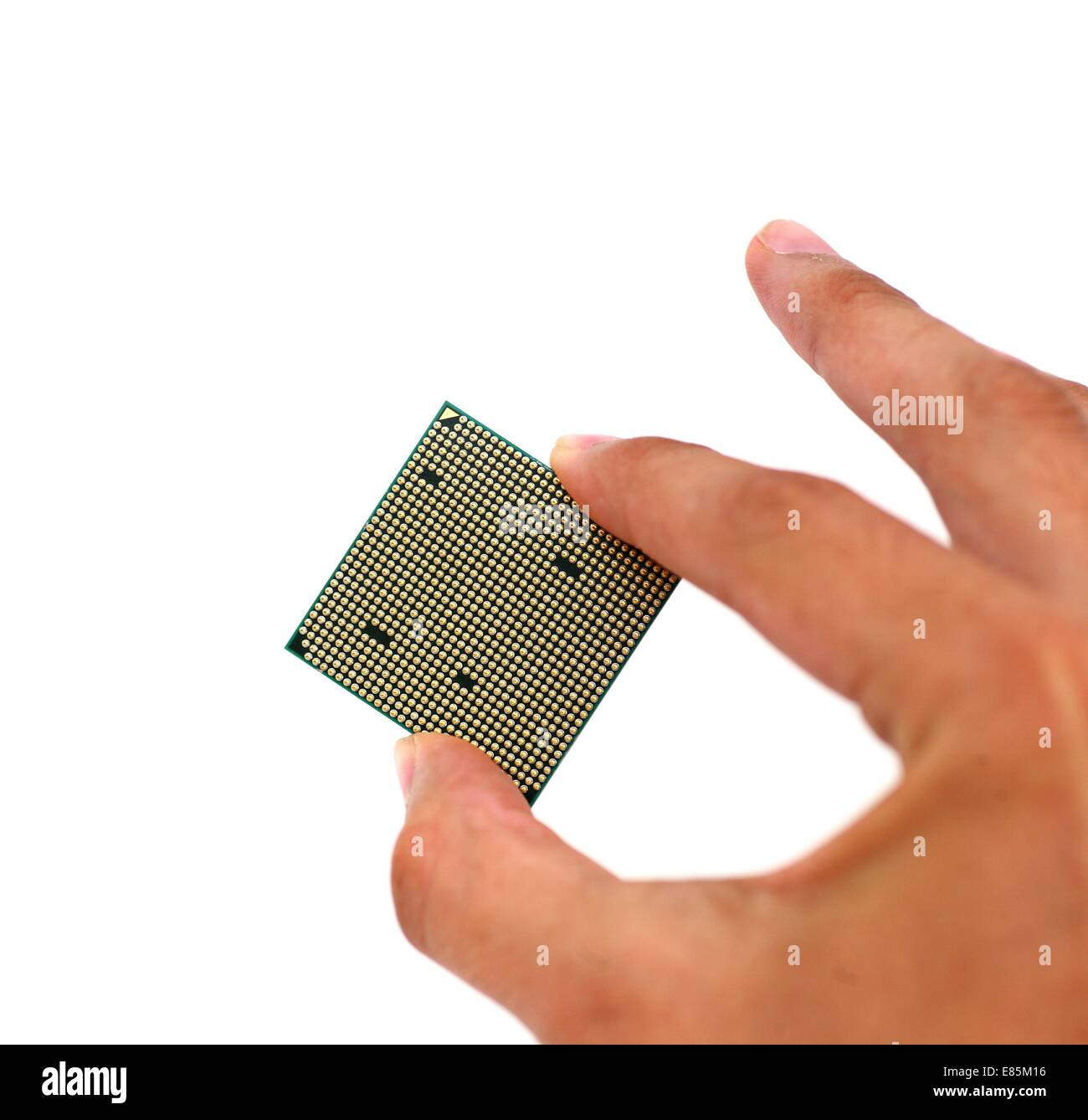 back of the microprocessor in hand isolated on white background Stock ...