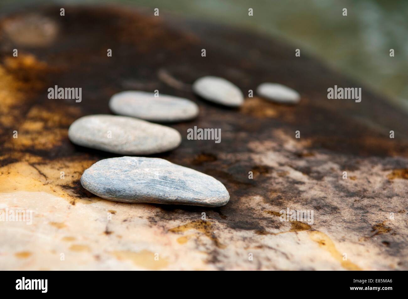 Rocks lined up Stock Photo - Alamy