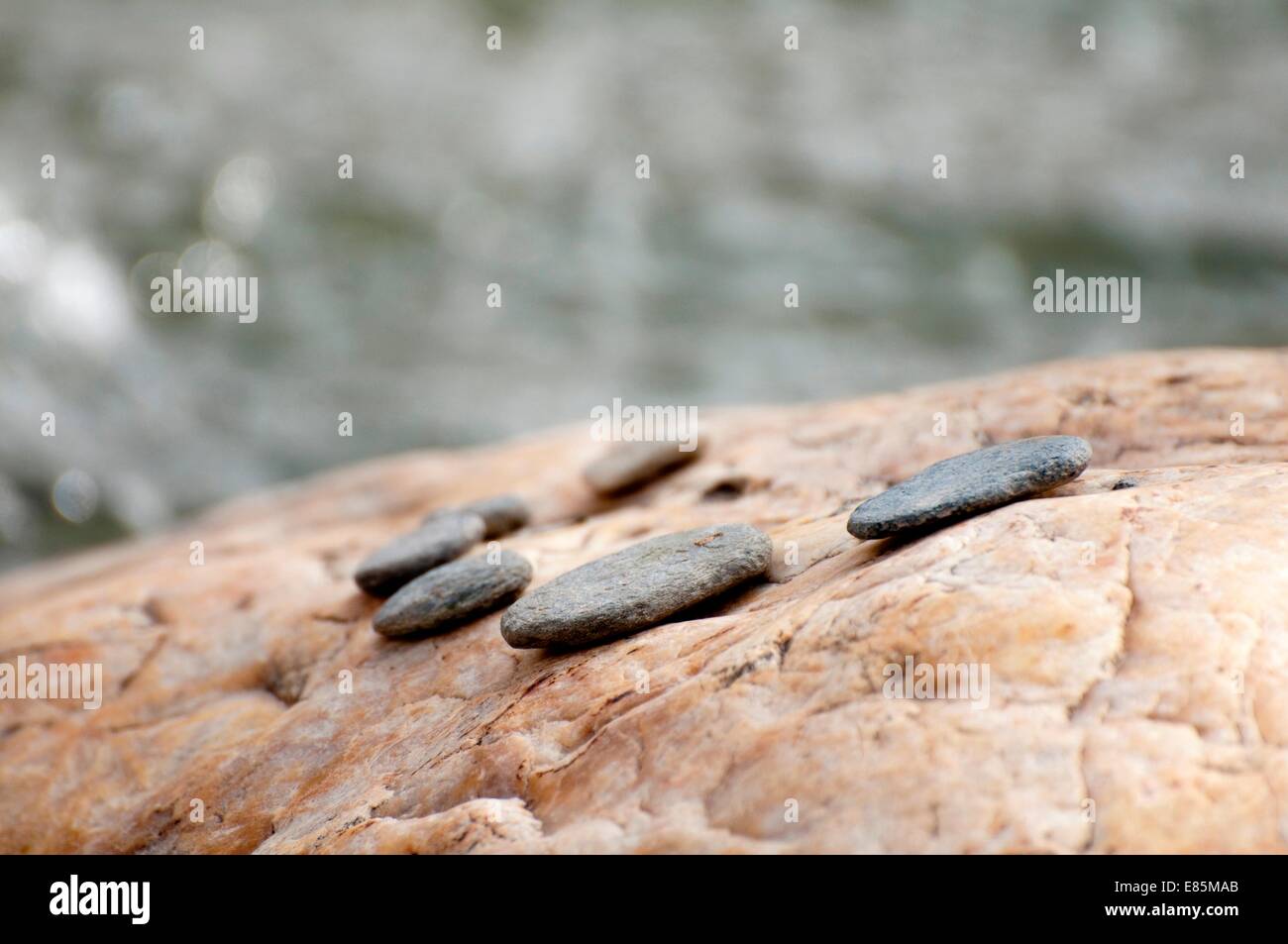 Rocks lined up Stock Photo - Alamy