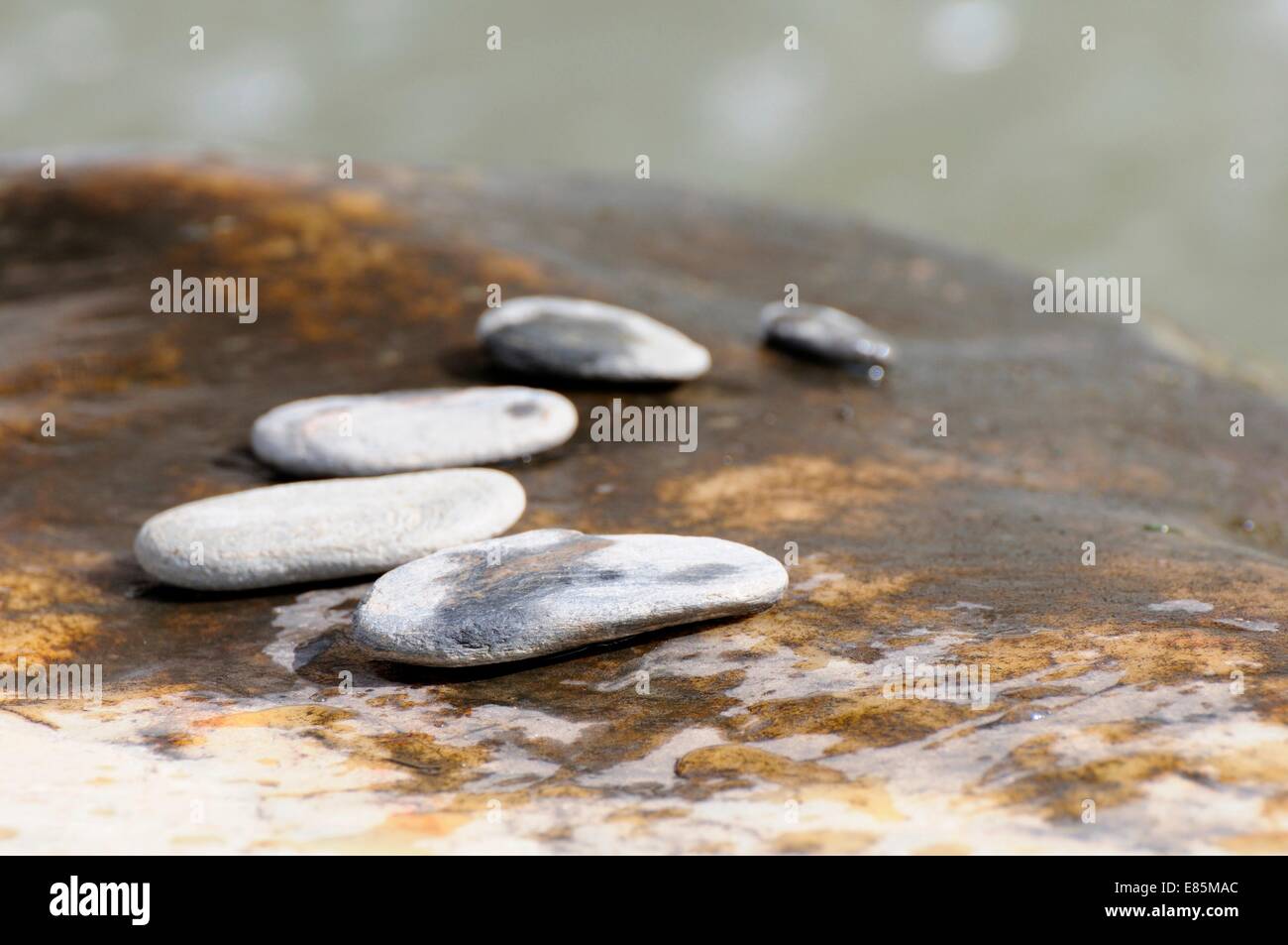 Rocks lined up Stock Photo - Alamy