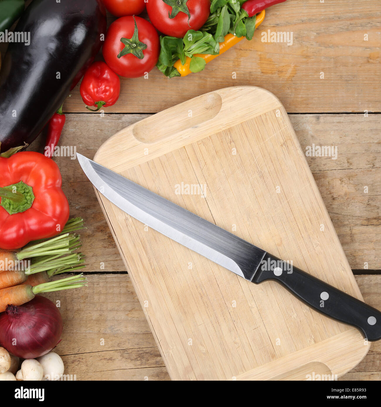 Healthy eating preparing and slicing food and vegetables knife on ...