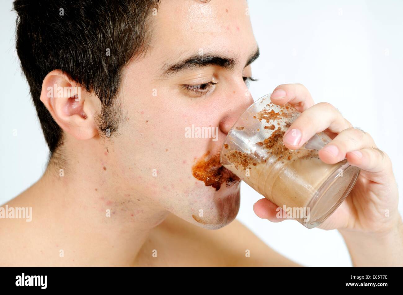 A man drinking chocolate milkshake Stock Photo - Alamy