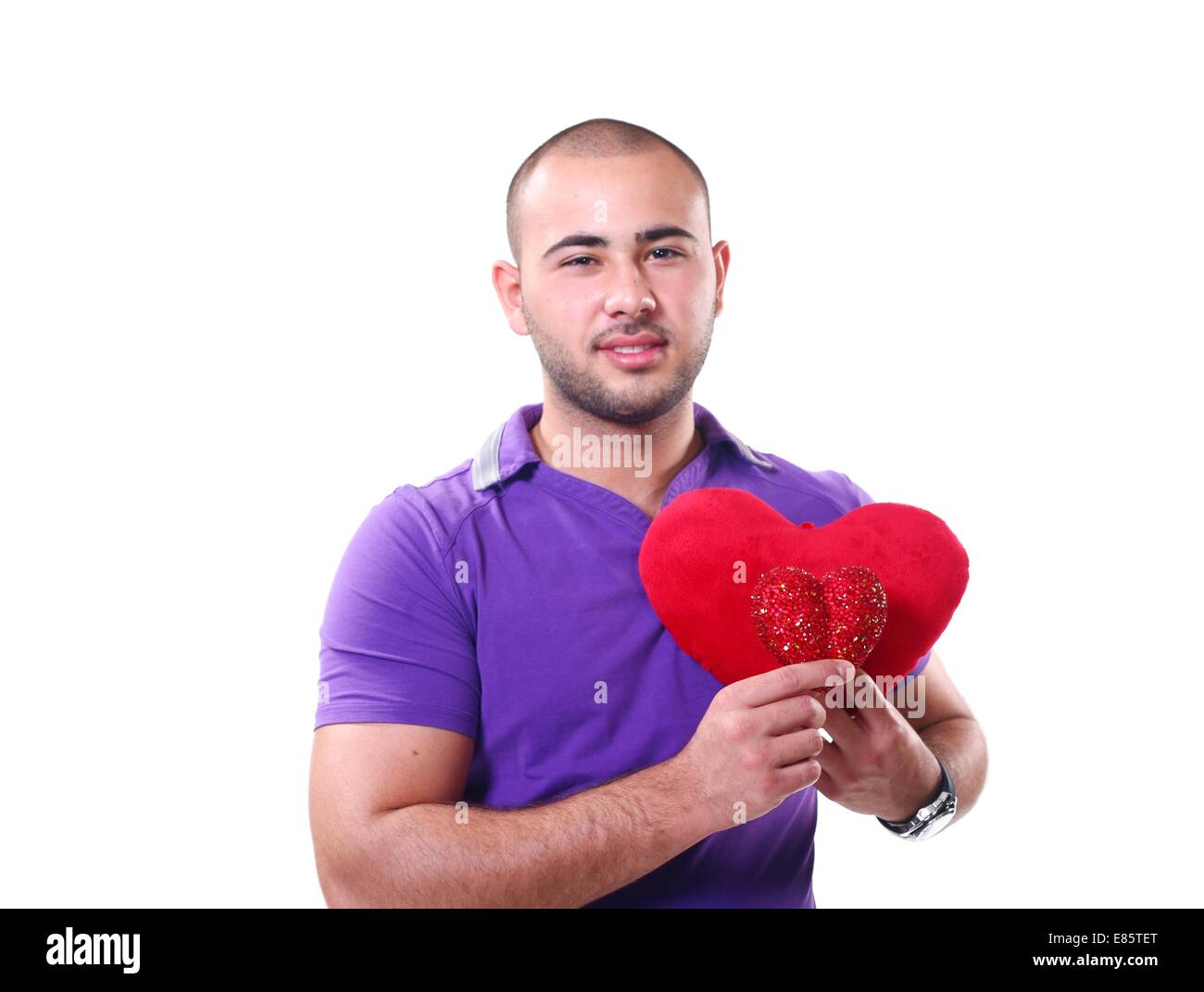 strong latino man 20-25 years in heart shape in studio on white ...