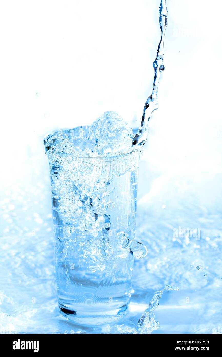 Water being poured in a transparent glass Stock Photo - Alamy