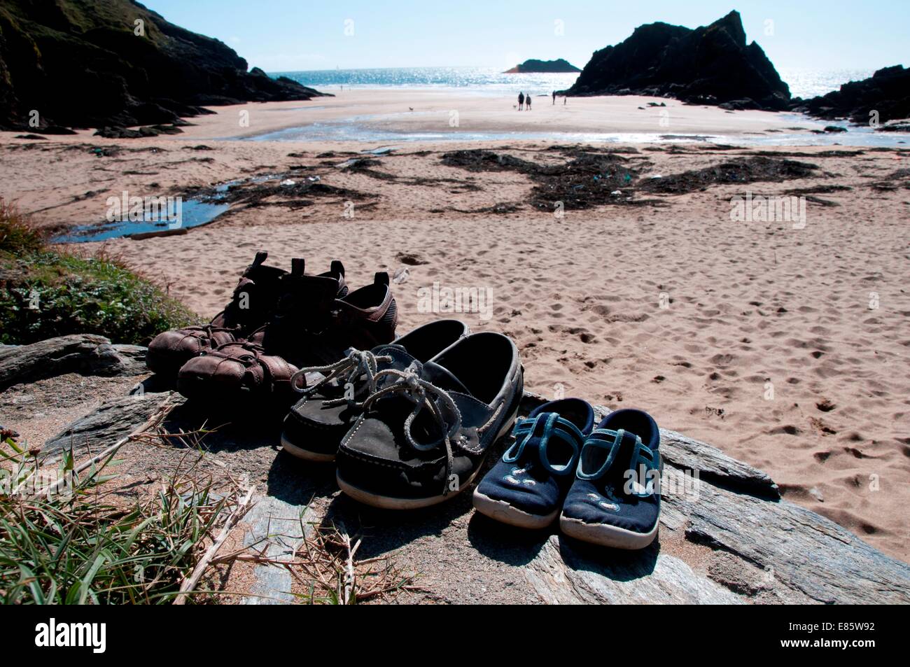 Shoes waiting at the side of the beach Stock Photo - Alamy
