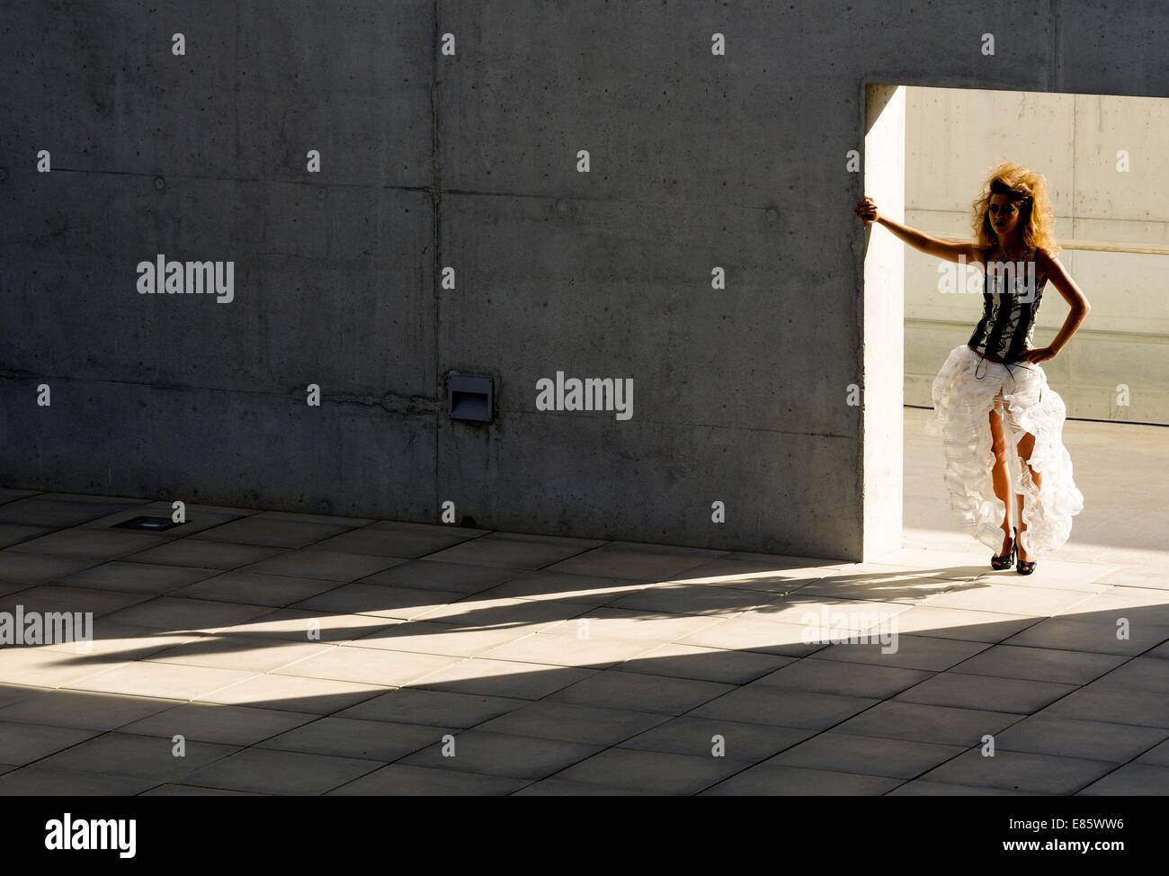 Women in doorway light shadow hi-res stock photography and images - Alamy