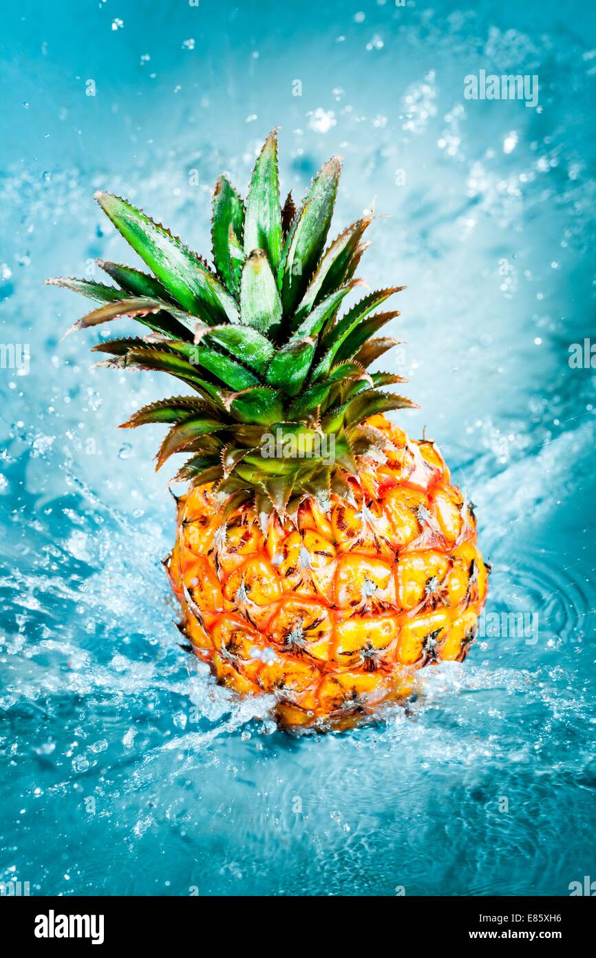 Fresh pineapple in water splashes Stock Photo - Alamy
