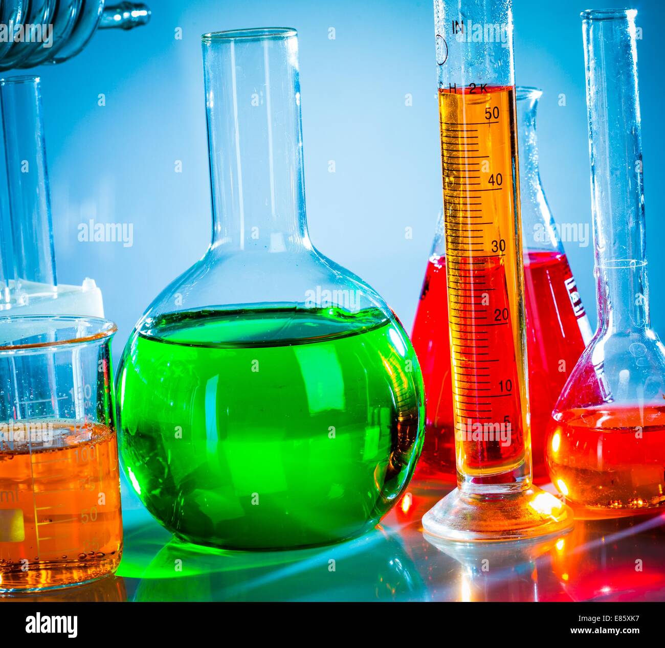 Test tubes on blue background Stock Photo - Alamy