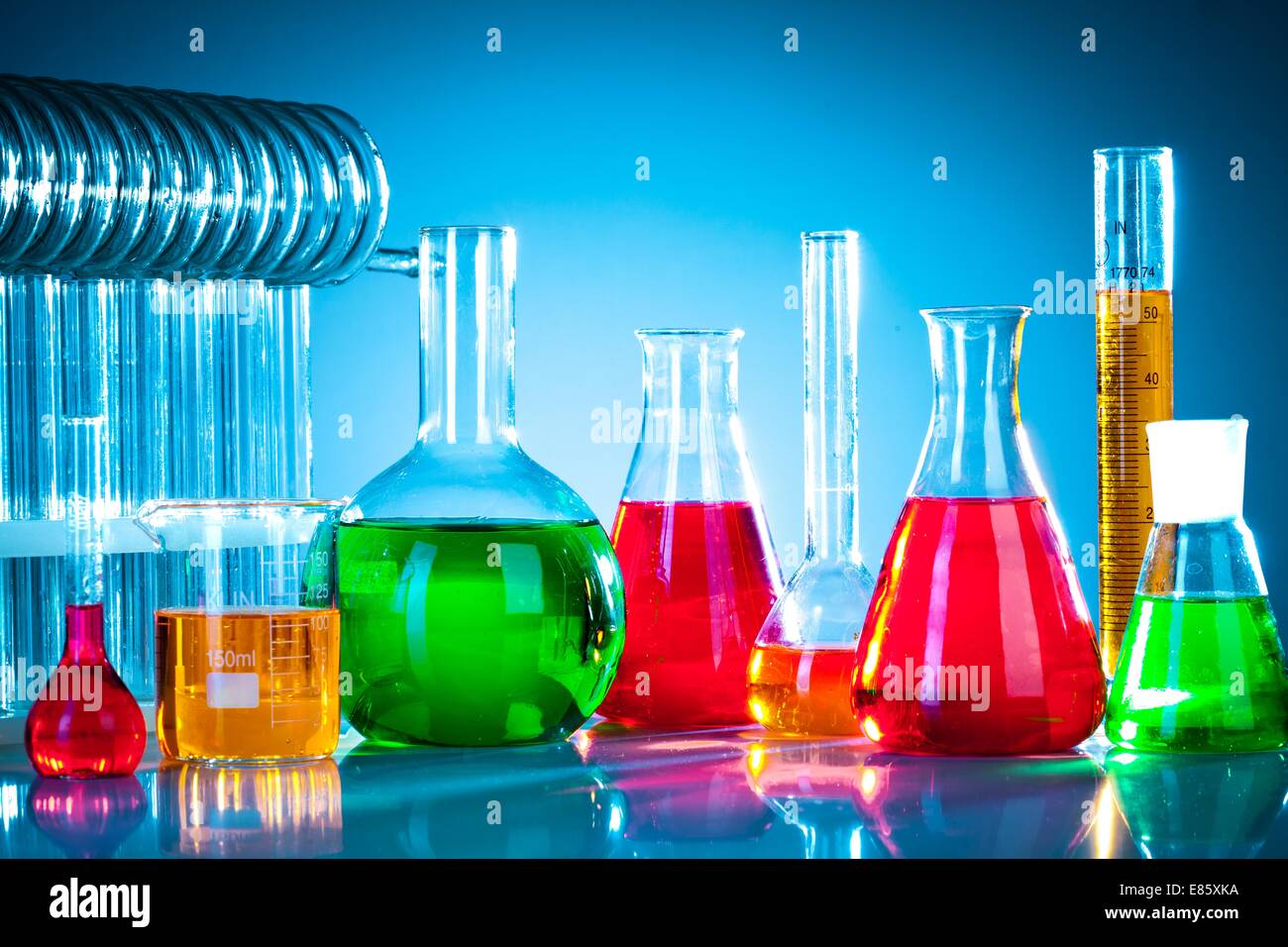 Test tubes on blue background Stock Photo - Alamy
