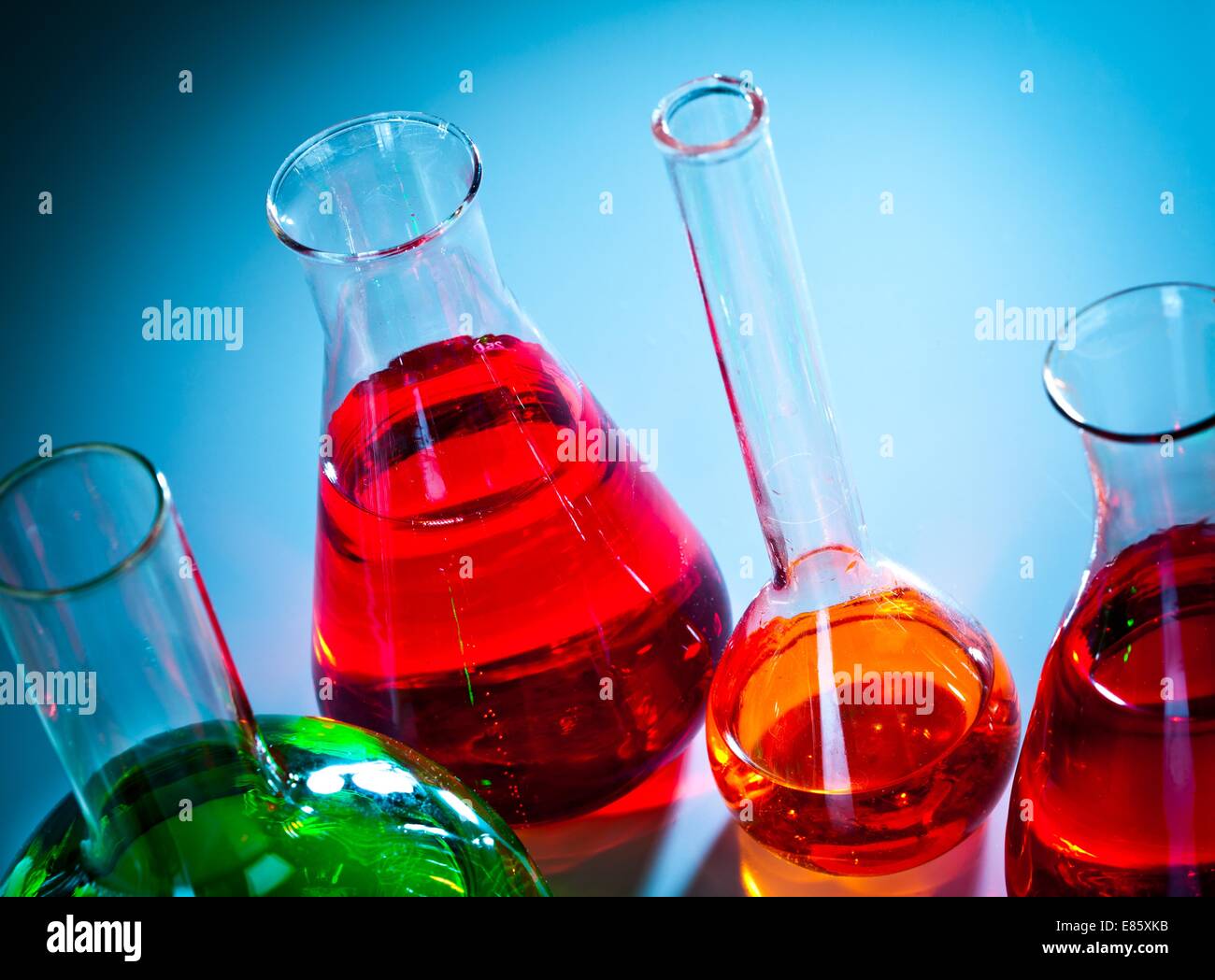 Test tubes on blue background Stock Photo - Alamy
