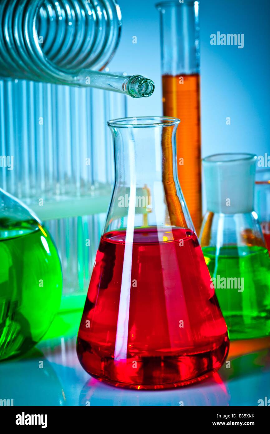 Test tubes on blue background Stock Photo - Alamy