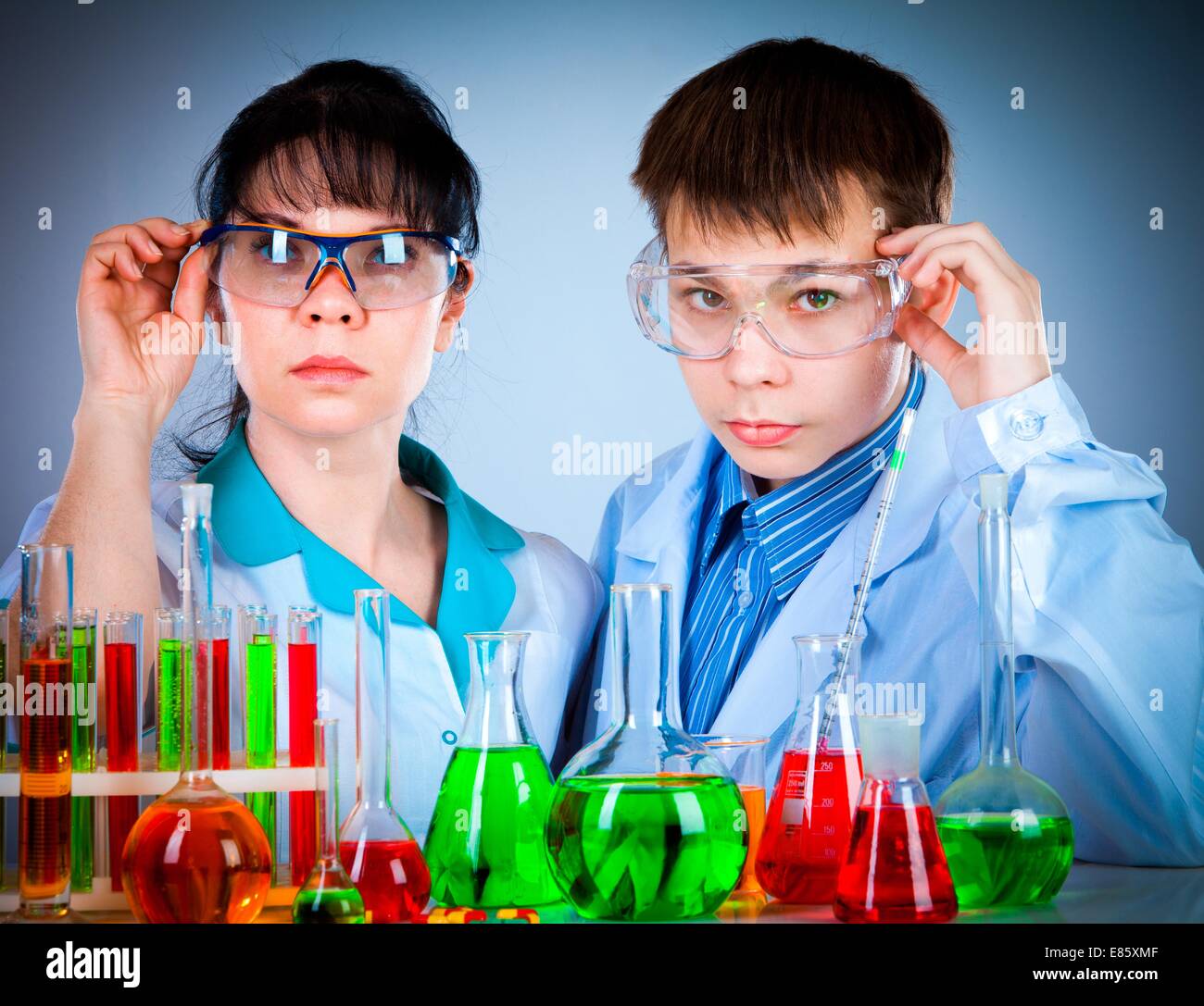 schoolteacher and student working in the lab Stock Photo - Alamy