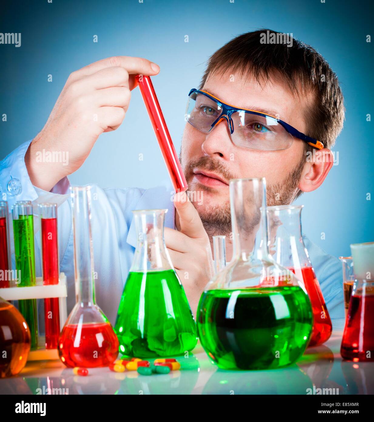 scientist in laboratory with test tubes Stock Photo - Alamy
