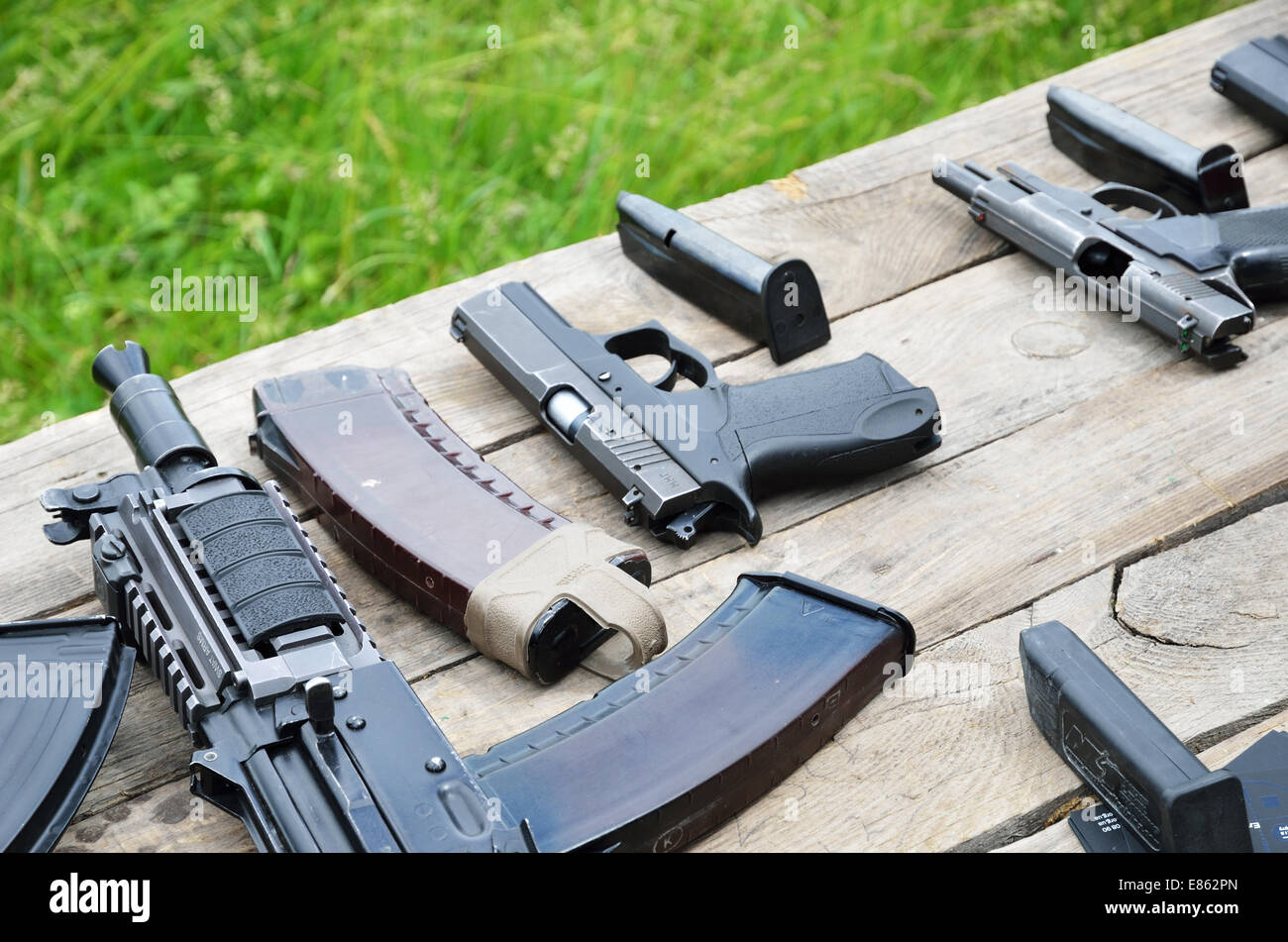 Portable guns on the table Stock Photo - Alamy