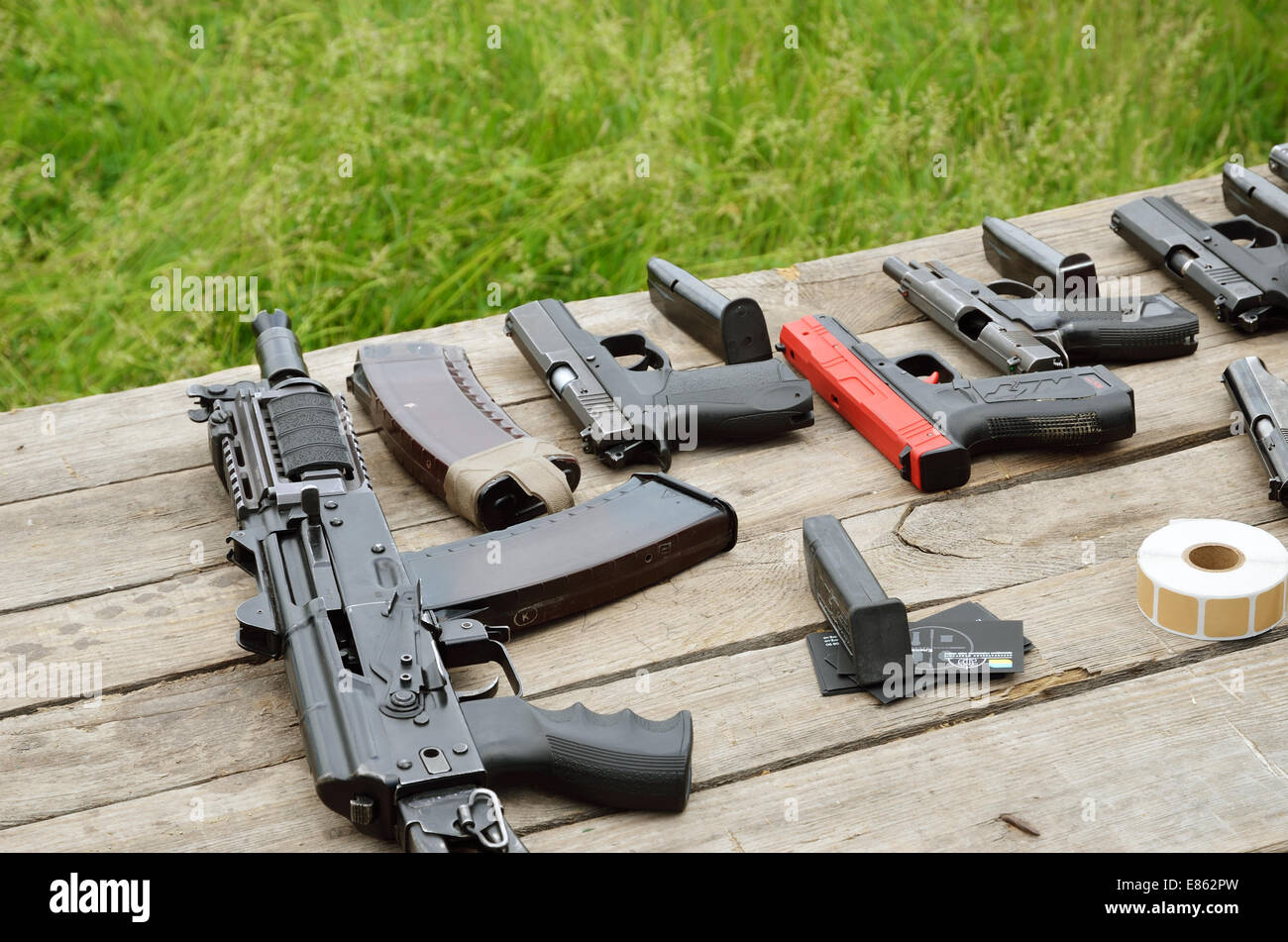 Portable guns on the table Stock Photo - Alamy