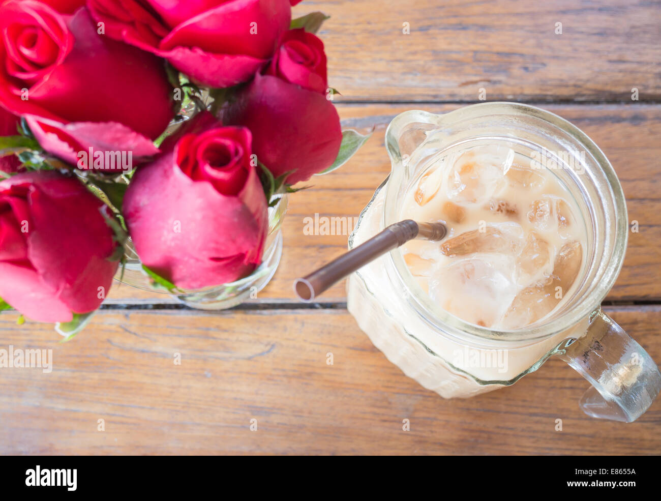 Romantic decoration table with iced coffee latte and red rose, stock ...
