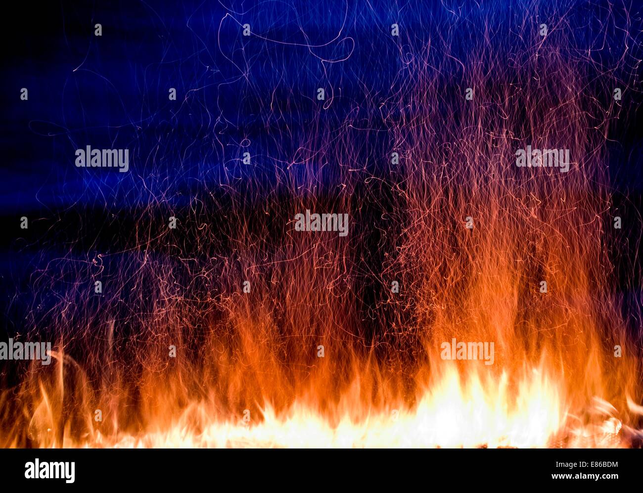 Fire photo on a dark blue background Stock Photo - Alamy