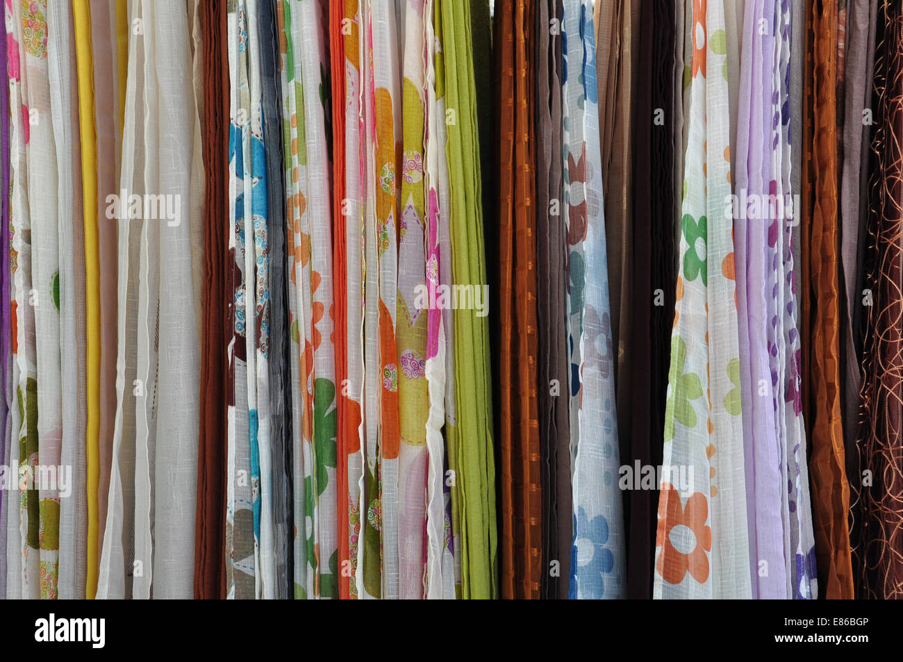 Colorful textiles for sale at street market. Abstract fabric background ...