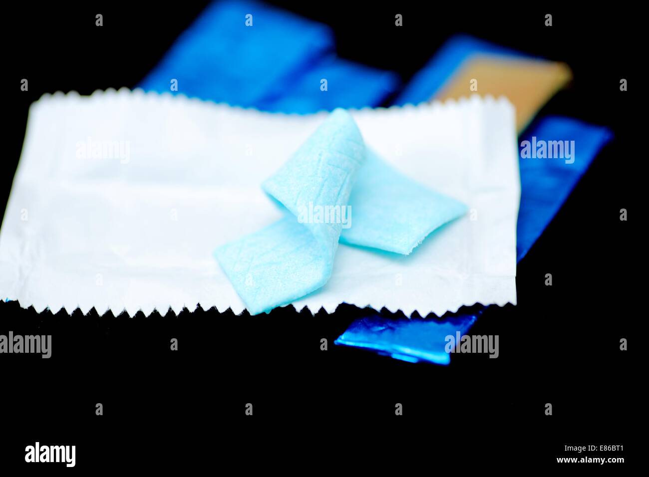 chewing gum partly opened, on black background Stock Photo - Alamy