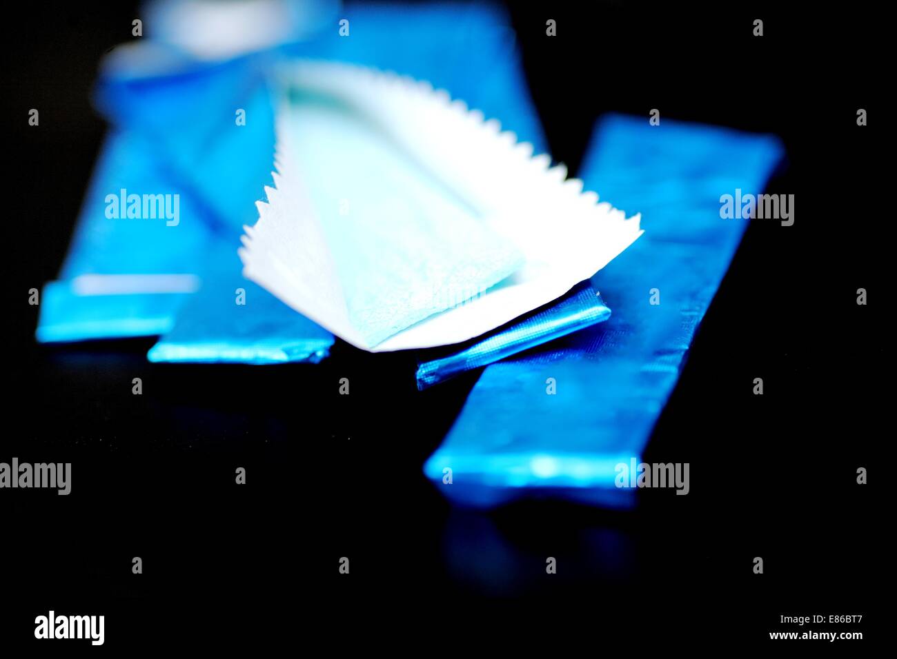 chewing gum partly opened, on black background Stock Photo - Alamy