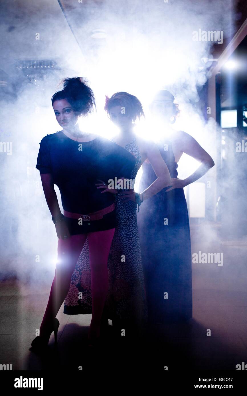Three glamorous girls having fun at disco in night club Stock Photo - Alamy
