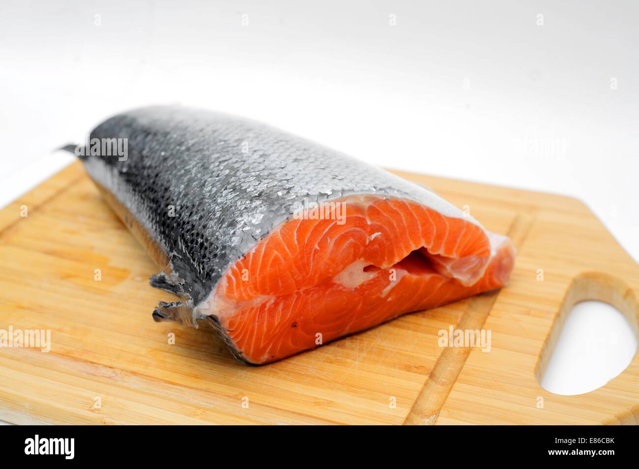 A piece of salmon in the fish section on a cutting board Stock Photo ...