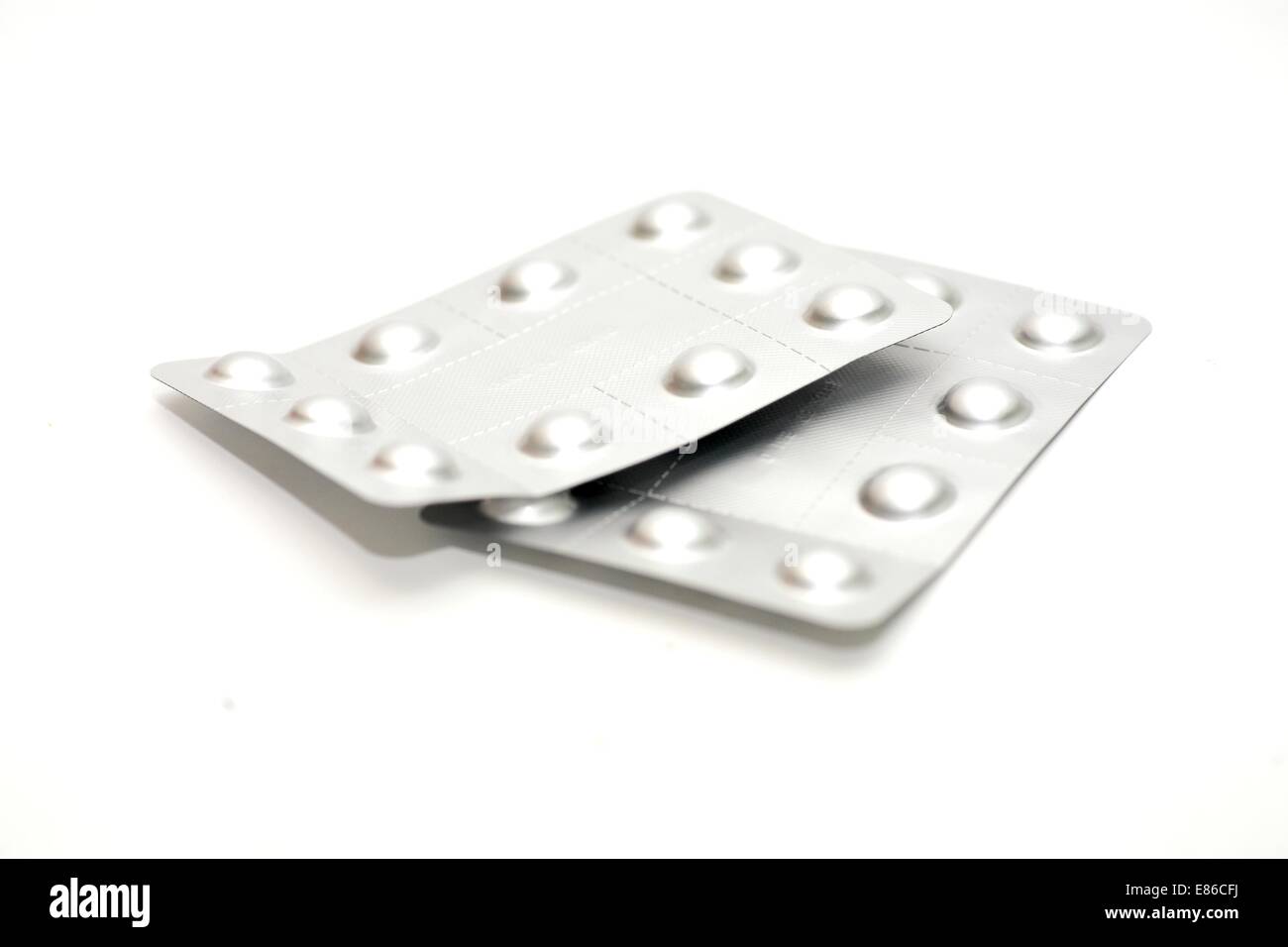 packaging of tablets on a white background Stock Photo - Alamy