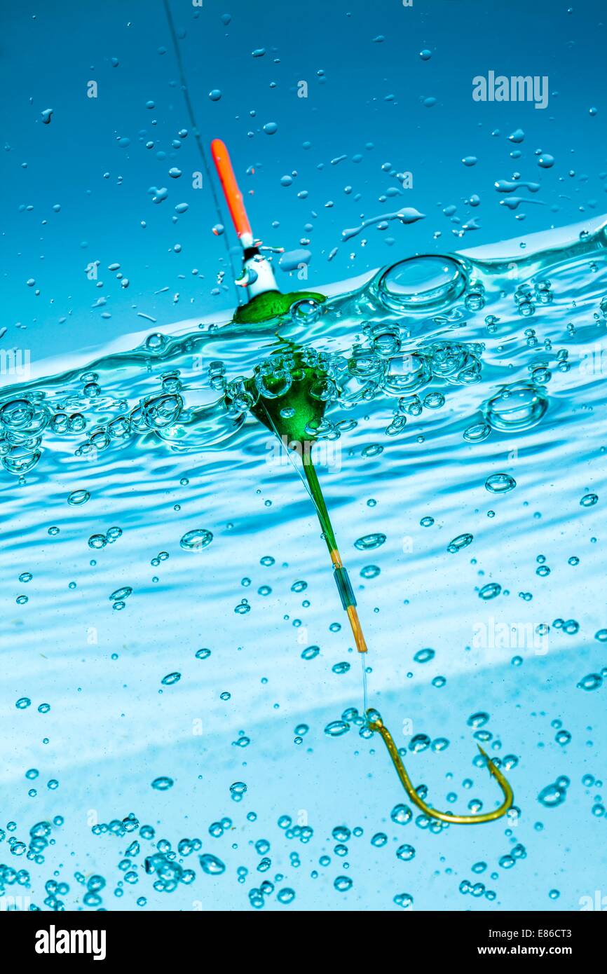 Fishing float against the blue background Stock Photo - Alamy