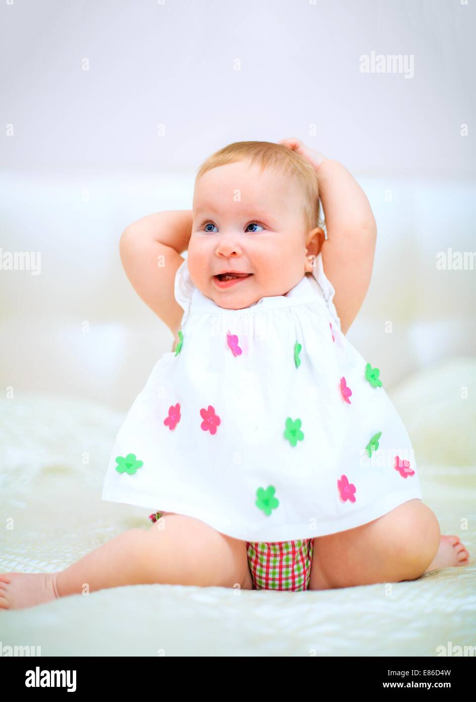 one years old baby girl on a light background Stock Photo - Alamy