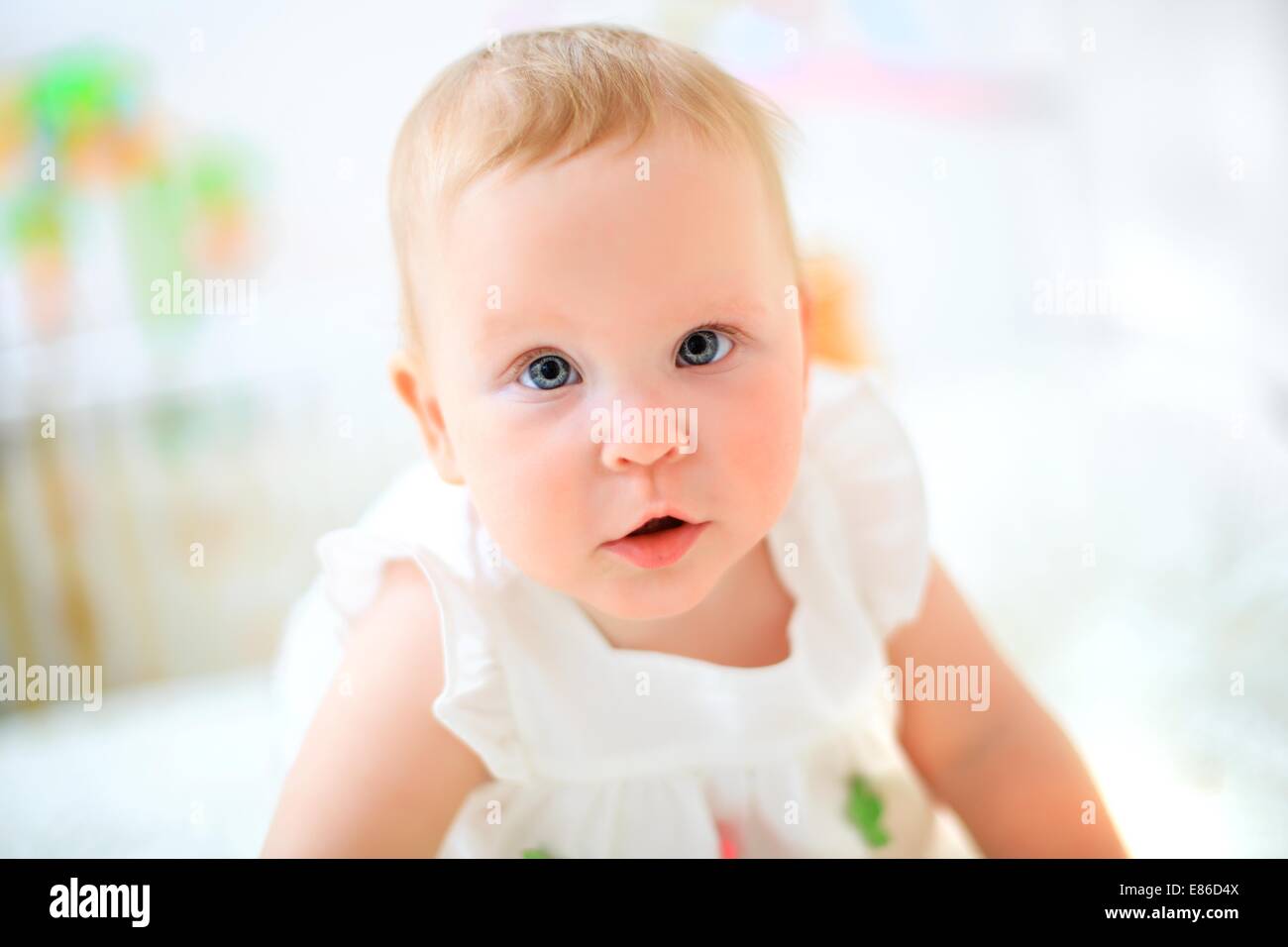 one years old baby girl on a light background Stock Photo - Alamy