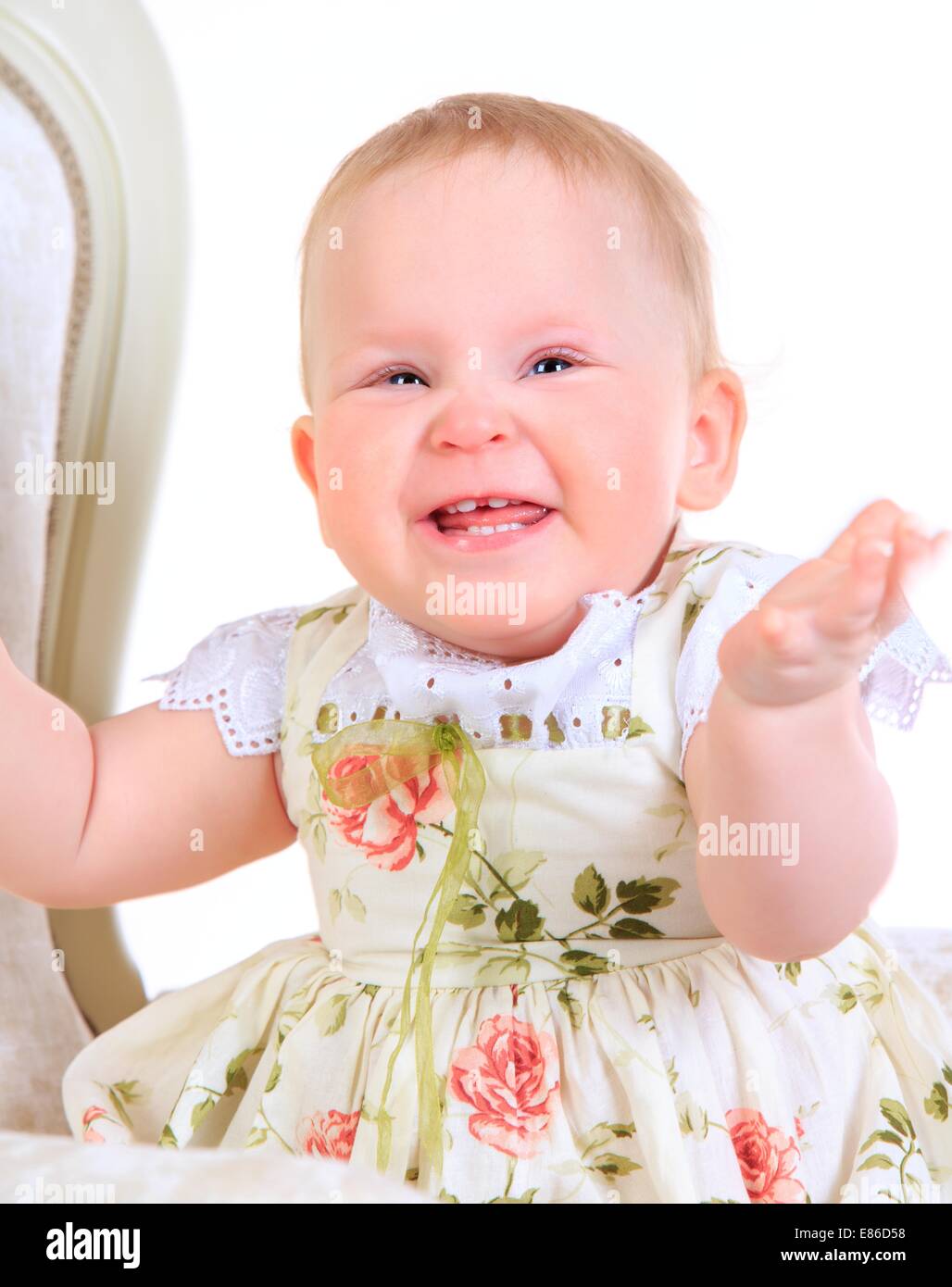 one years old baby girl on a white background Stock Photo - Alamy
