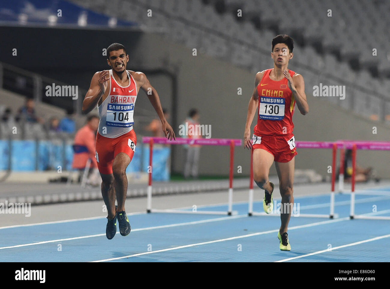 Incheon, South Korea. 1st Oct, 2014. Cheng Wen (R) of China and Khamis ...