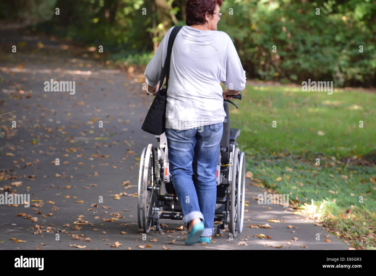 Pushing grandma in wheelchair hi-res stock photography and images - Alamy