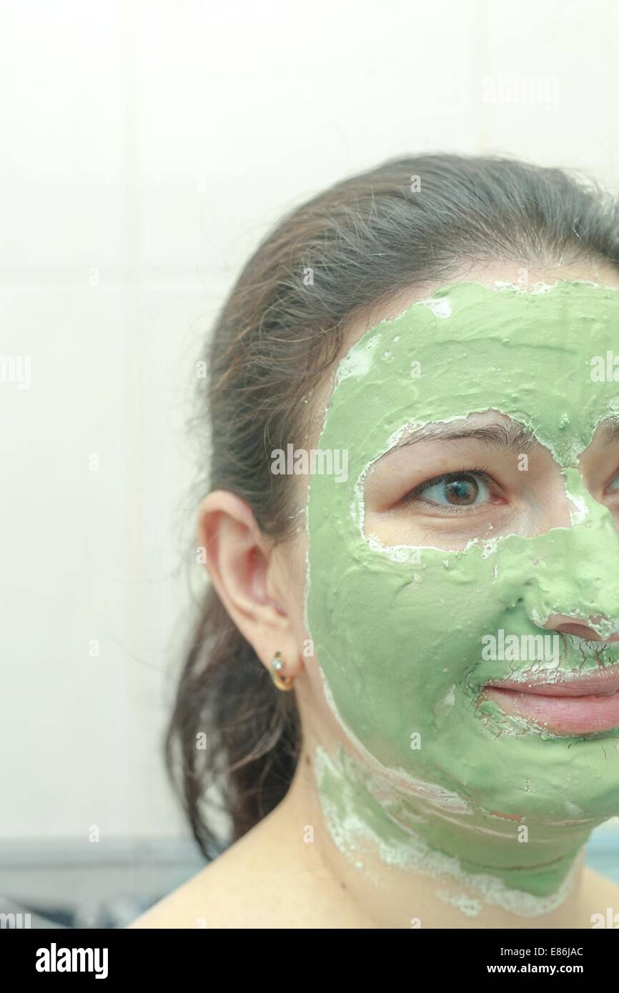 woman with green mask on face healthy treatment Stock Photo - Alamy