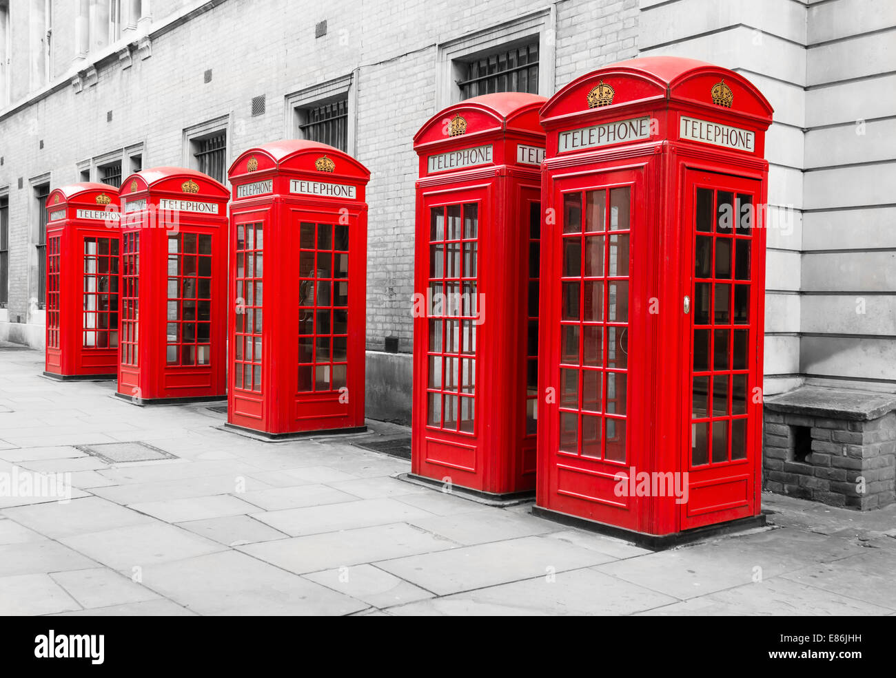 Typical London Red Telephone Boxes on a black and white background ...