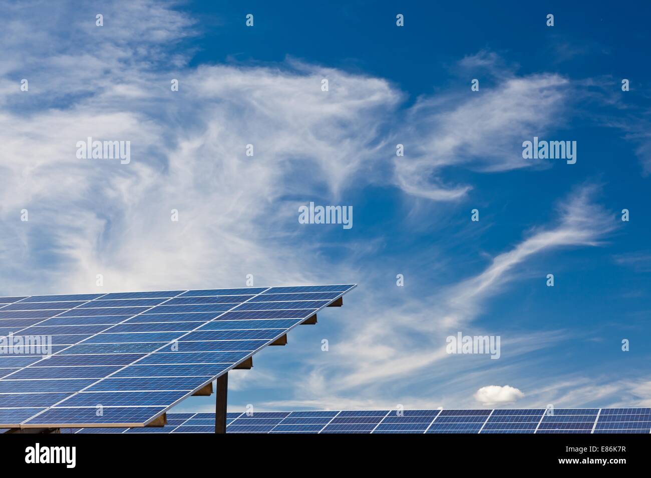 Photovoltaic panels in a solar power plant over a deep blue sky Stock Photo - Alamy
