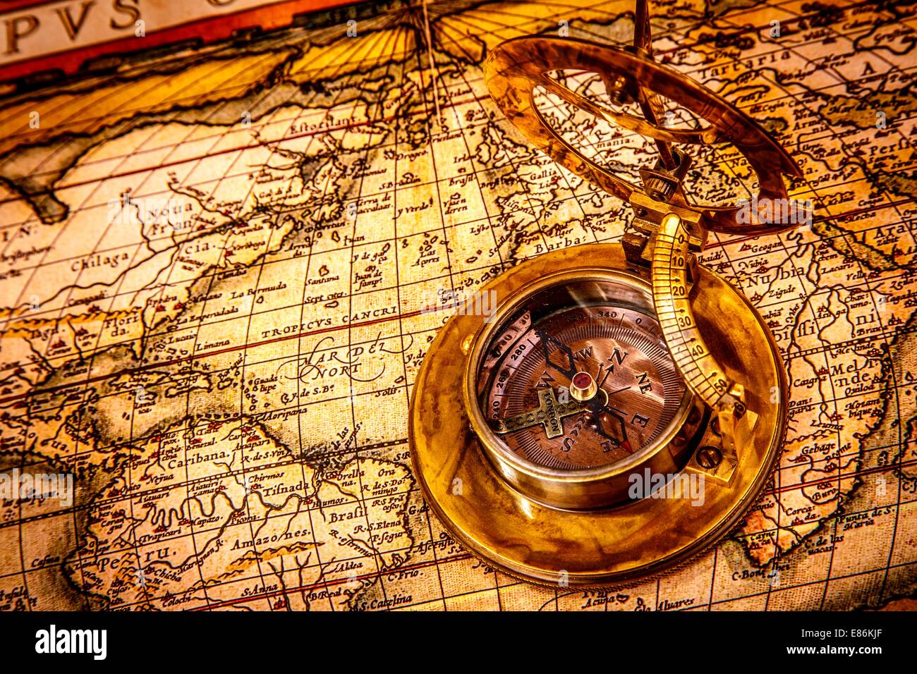 Vintage still life. Vintage compass lies on an ancient world map Stock ...