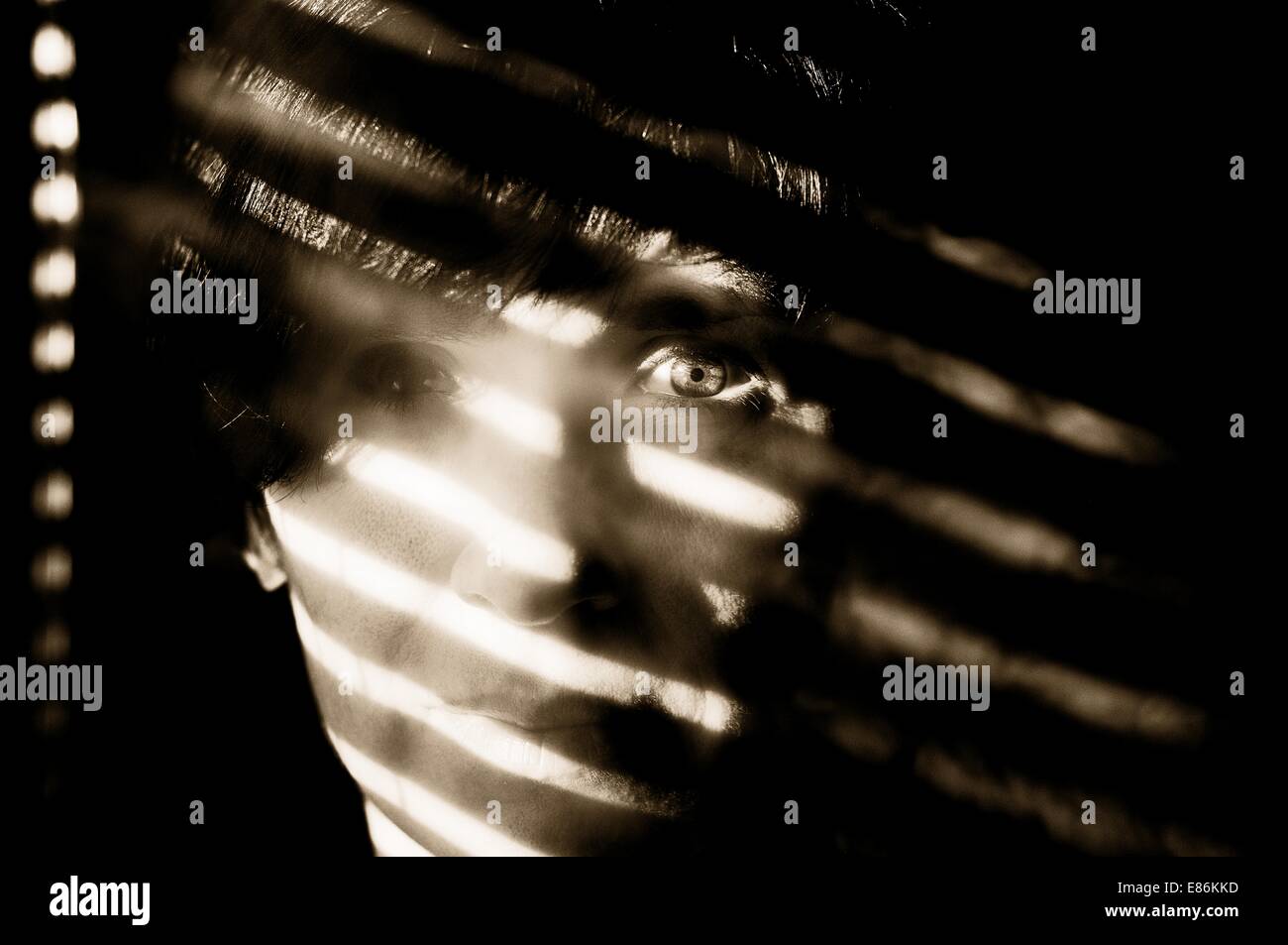 Portrait with shadows across face Stock Photo - Alamy