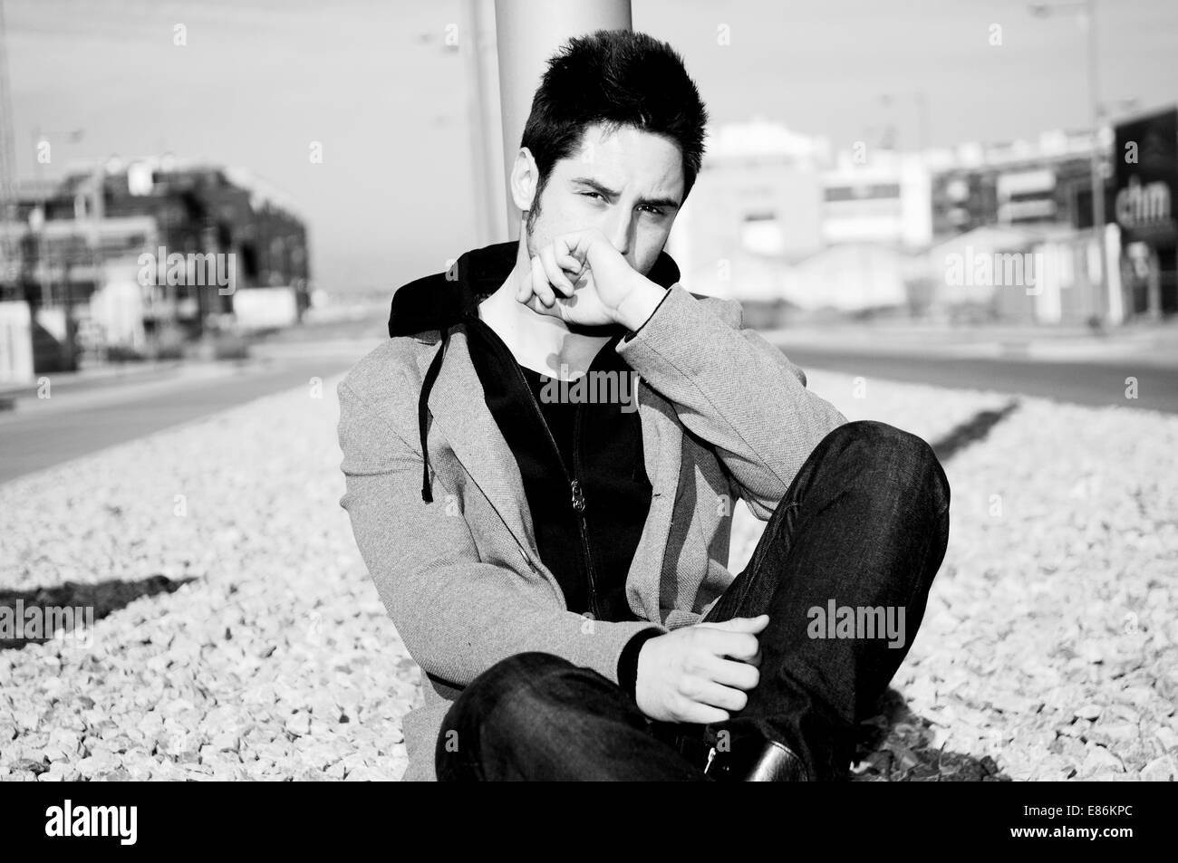 Portrait of handsome man in urban background Stock Photo - Alamy