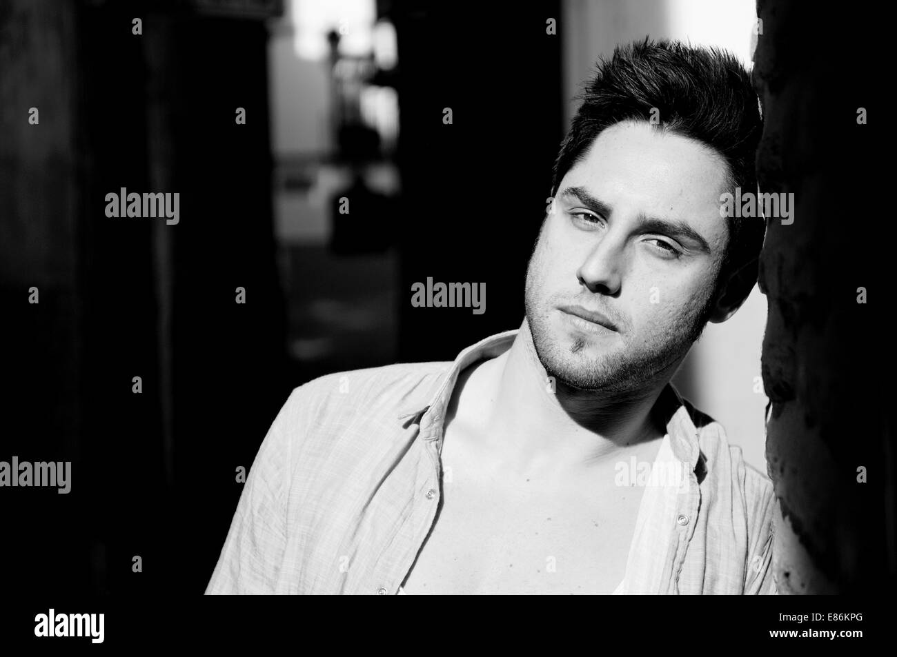 Portrait of handsome man in urban background Stock Photo - Alamy