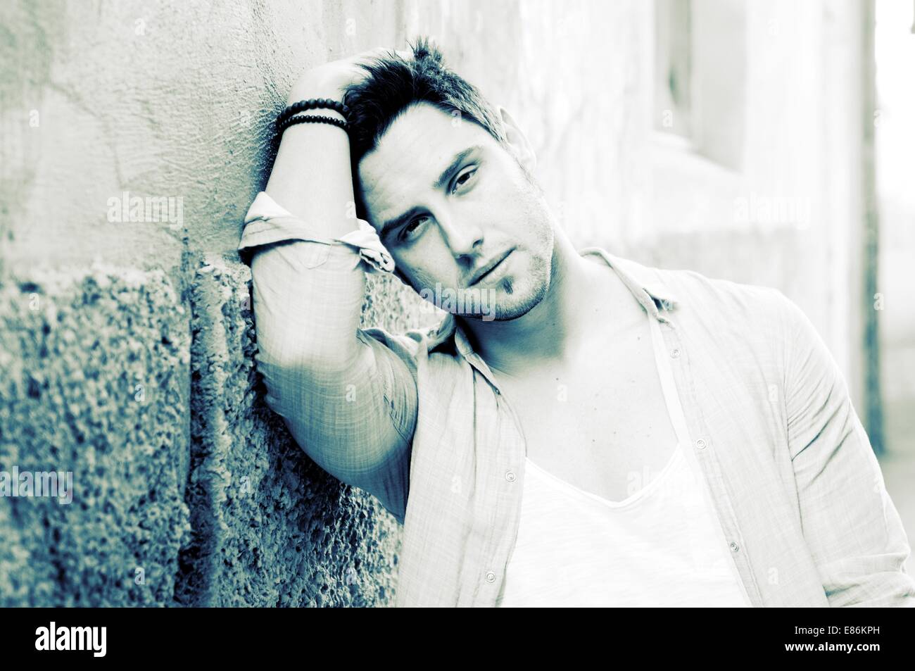 Portrait of handsome man in urban background Stock Photo - Alamy