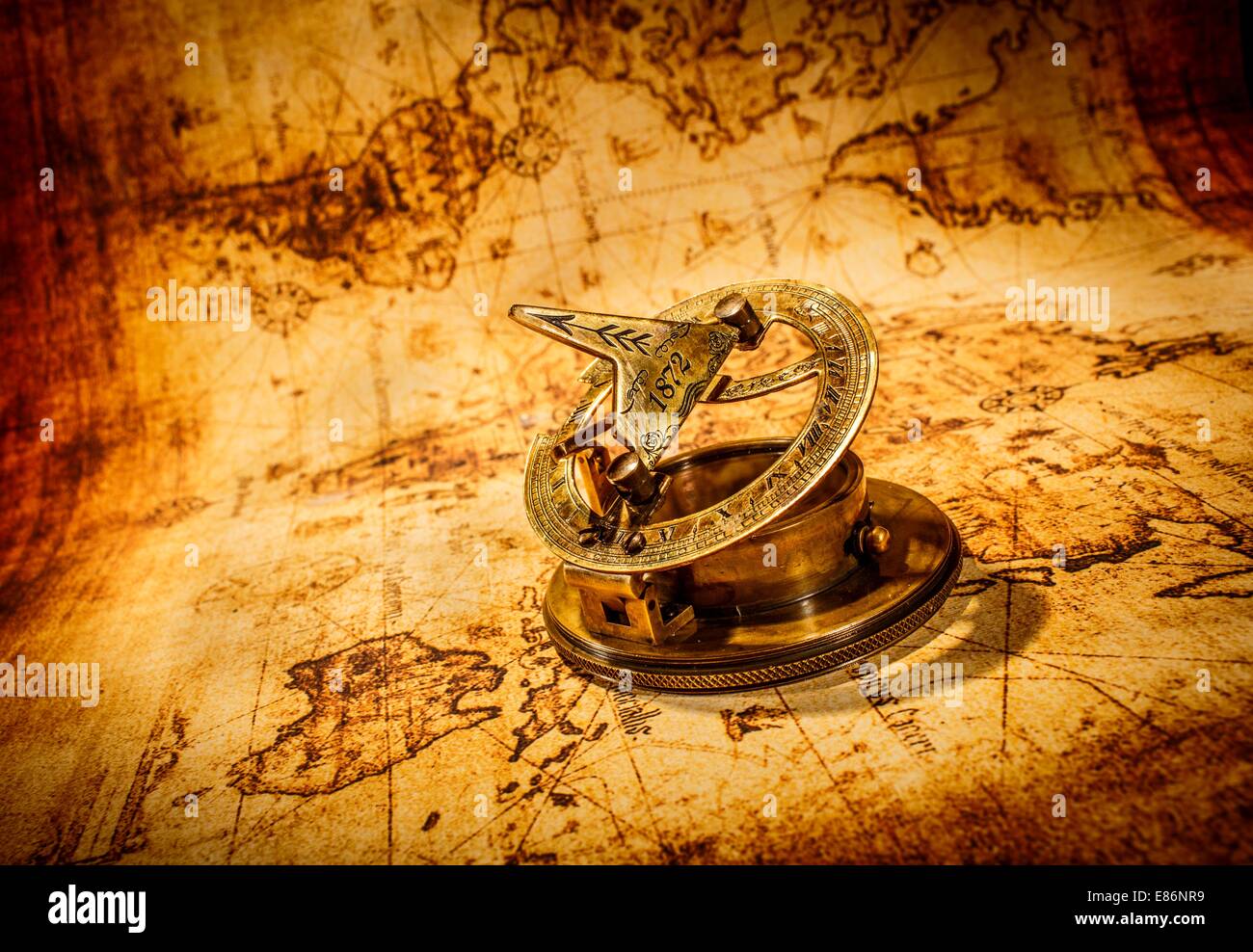 Vintage still life. Vintage compass lies on an ancient world map Stock ...