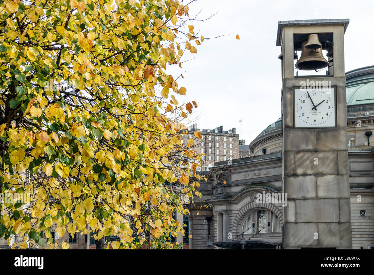 Clock tower autumn leaves, the Usher Hall with Edinburgh Castle in the ...