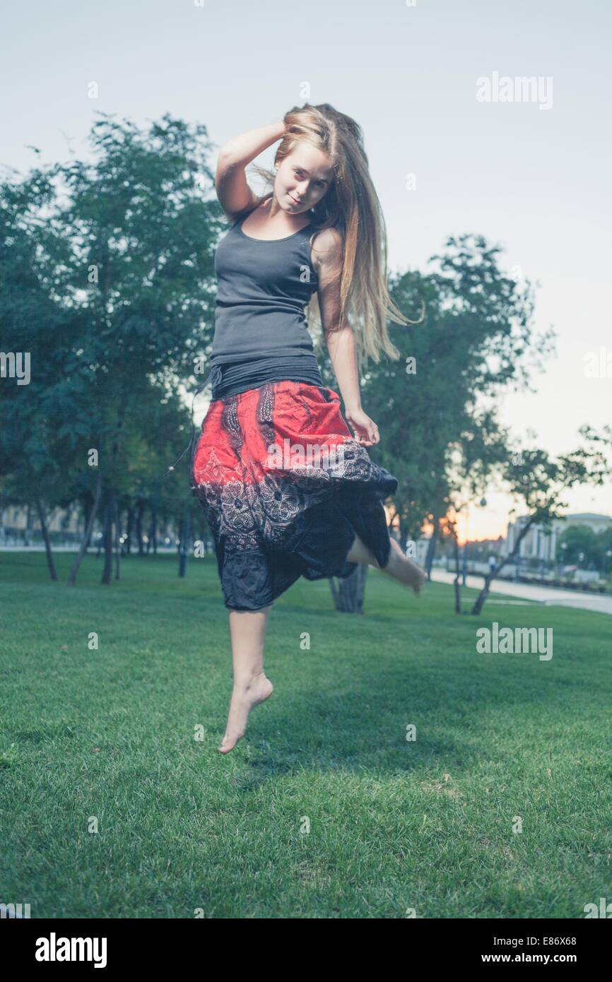 City ballet. Lonely dacer performing alone. Girl jumping like flying ...